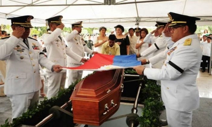 Marcos Buried In Simple Wood Coffin: Where's The Bronze Casket?