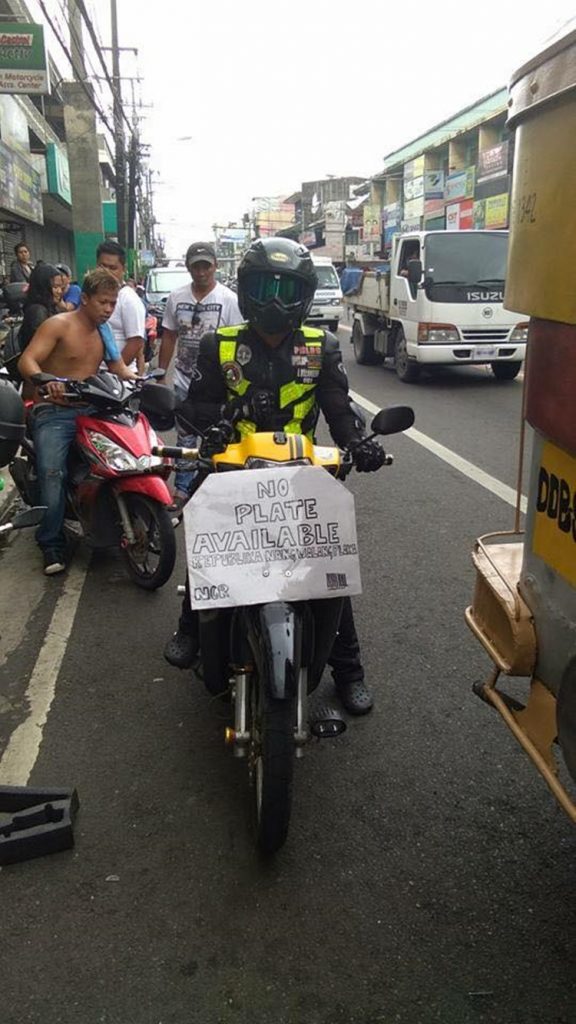 Motorist Displays The Newly Proposed Size Of Vehicle Registration Plate