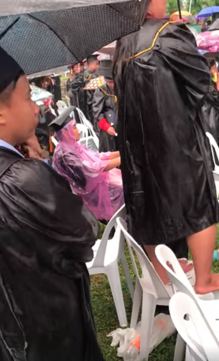 College Student Wearing Raincoat During Graduation Rites Goes Viral
