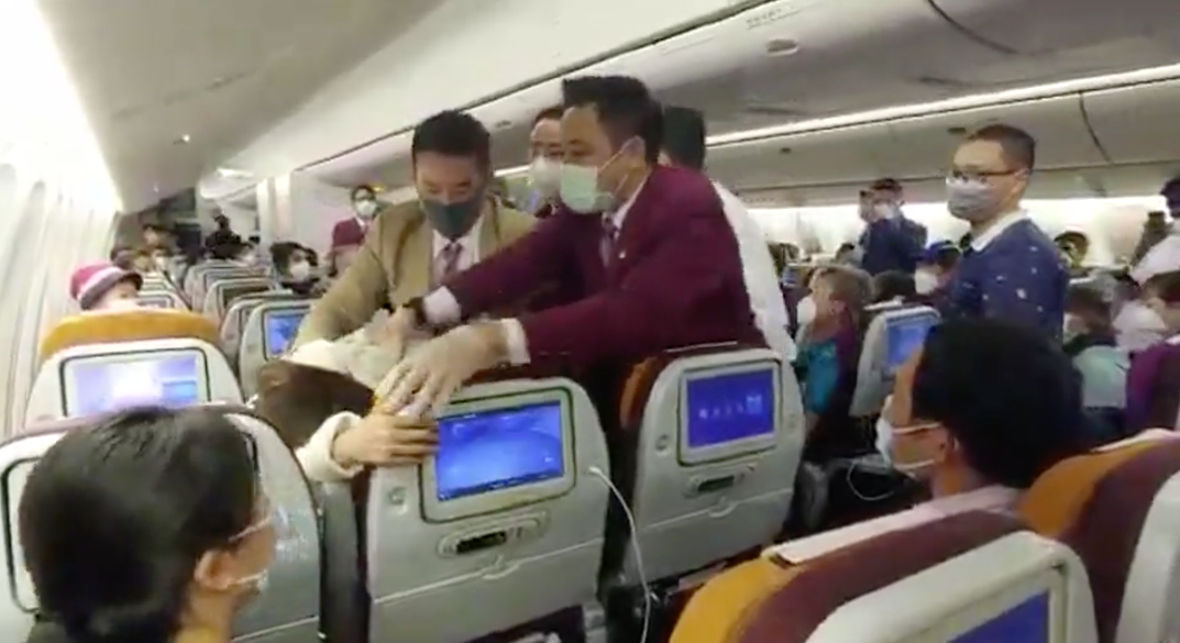 Woman Got Tackled for Coughing on Flight Attendant Amid COVID-19 Scare