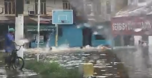 Video of Residents Joining Swimming Competition in Floodwaters Goes Viral