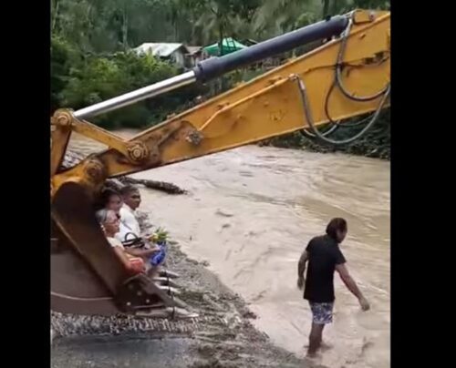 Newly-Wed Couple Goes Viral For Riding Backhoe to Reach Reception Venue