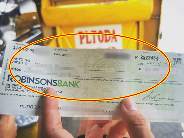 Male Passenger Uses Cheque to Pay Fare on Tricycle