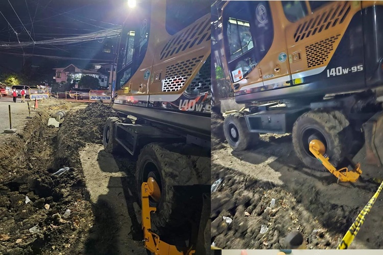 Backhoe Used to Repair Damaged Road Clamped for Parking Violations