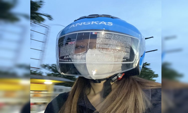 Lady Passenger Wearing helmet w/ Unremoved Sticker Goes Viral