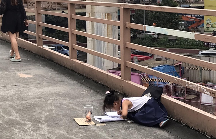 Young Female Student Kneeling on Concrete Road While Studying Touches ...